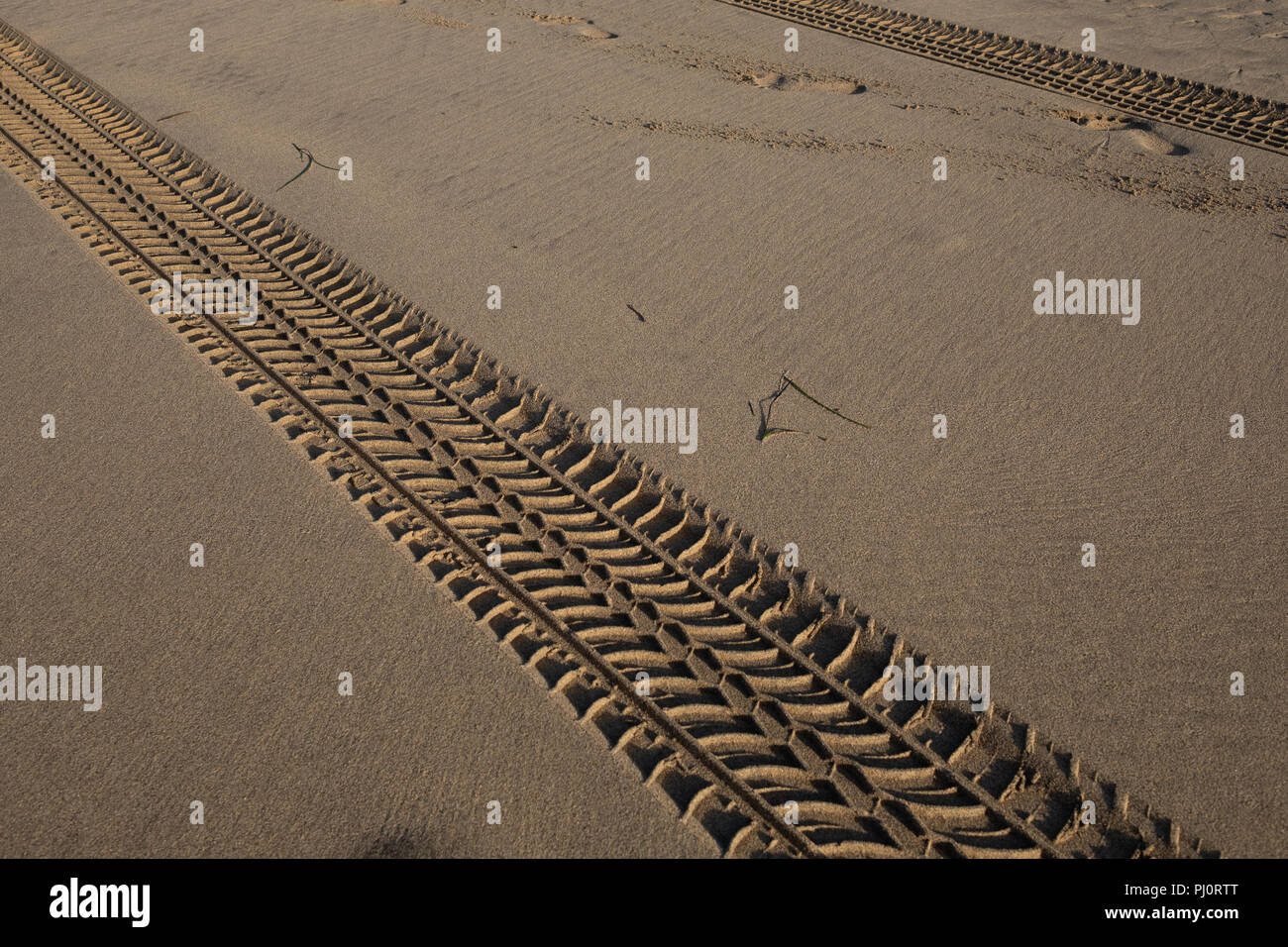 Wheel Tracks in Sand at the Beach Stock Photo - Alamy