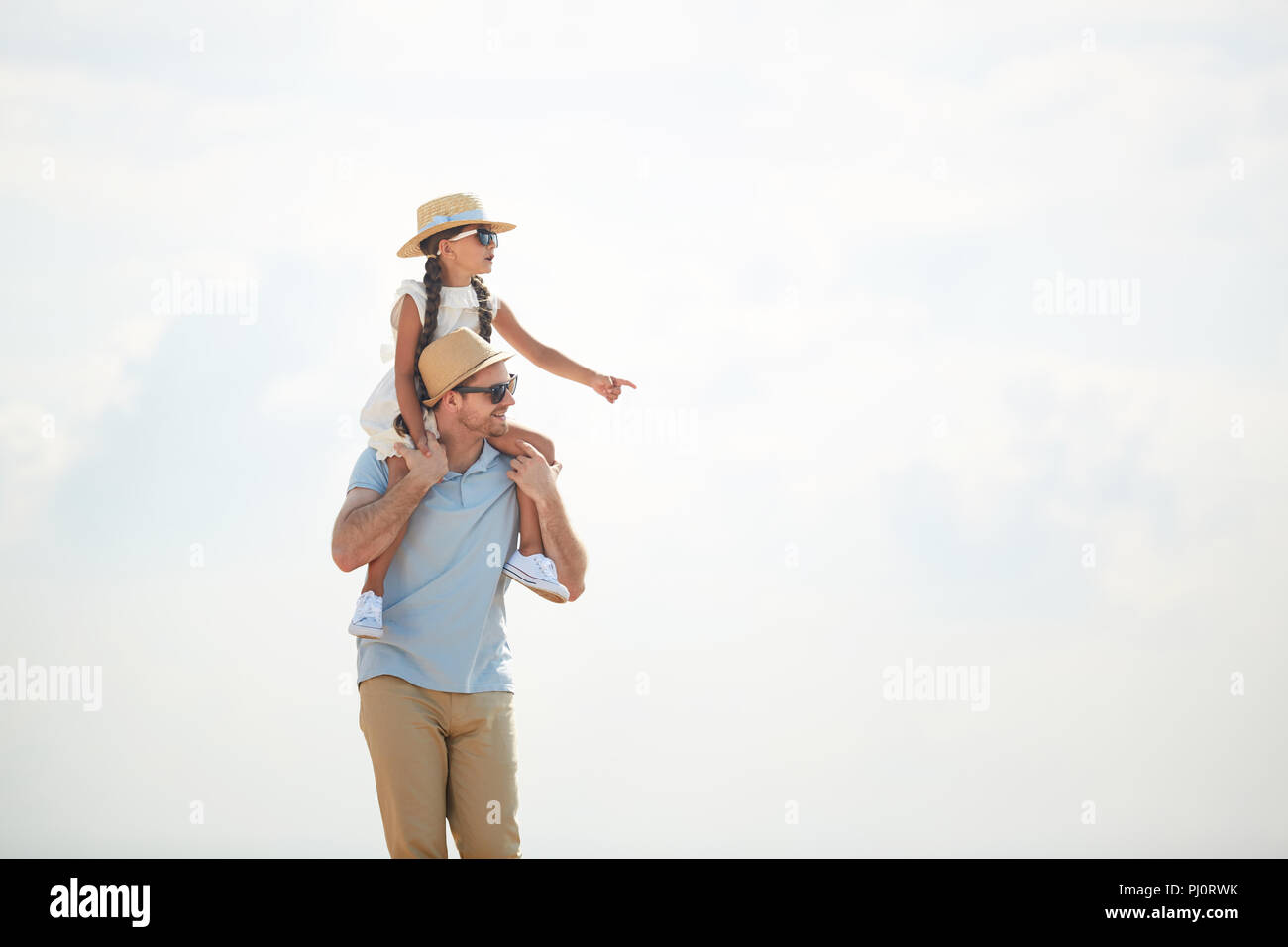 Father carrying daughter shoulders by sea hi-res stock photography and images - Alamy