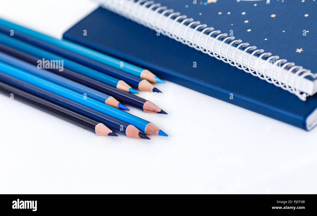 Back to school blue items on white background. Notebook and set of blue ...