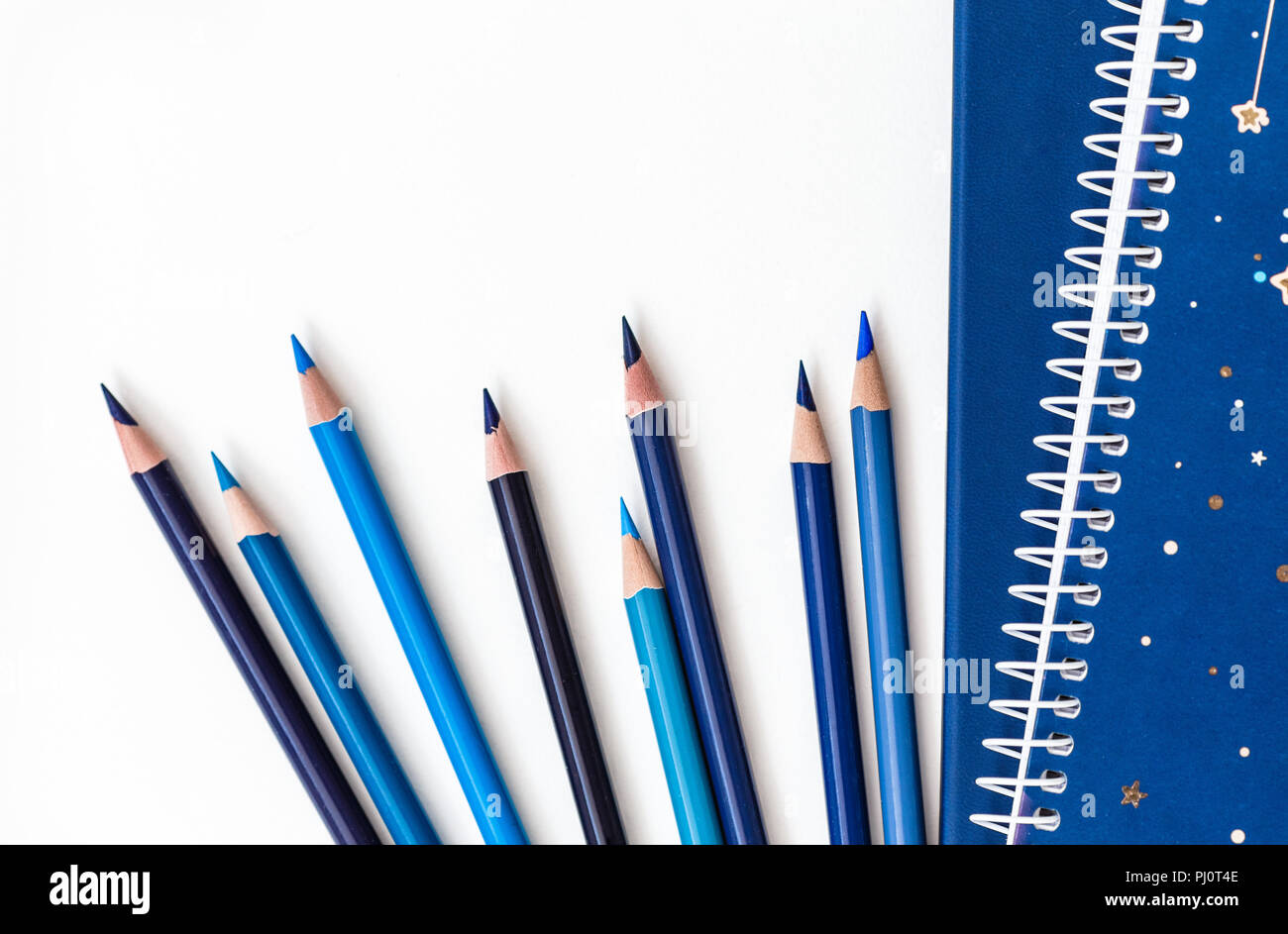 Back to school blue items on white background. Notebook and set of blue ...