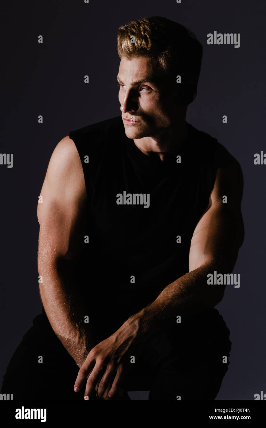 Handsome man posing in the studio for clothes shooting Stock Photo - Alamy