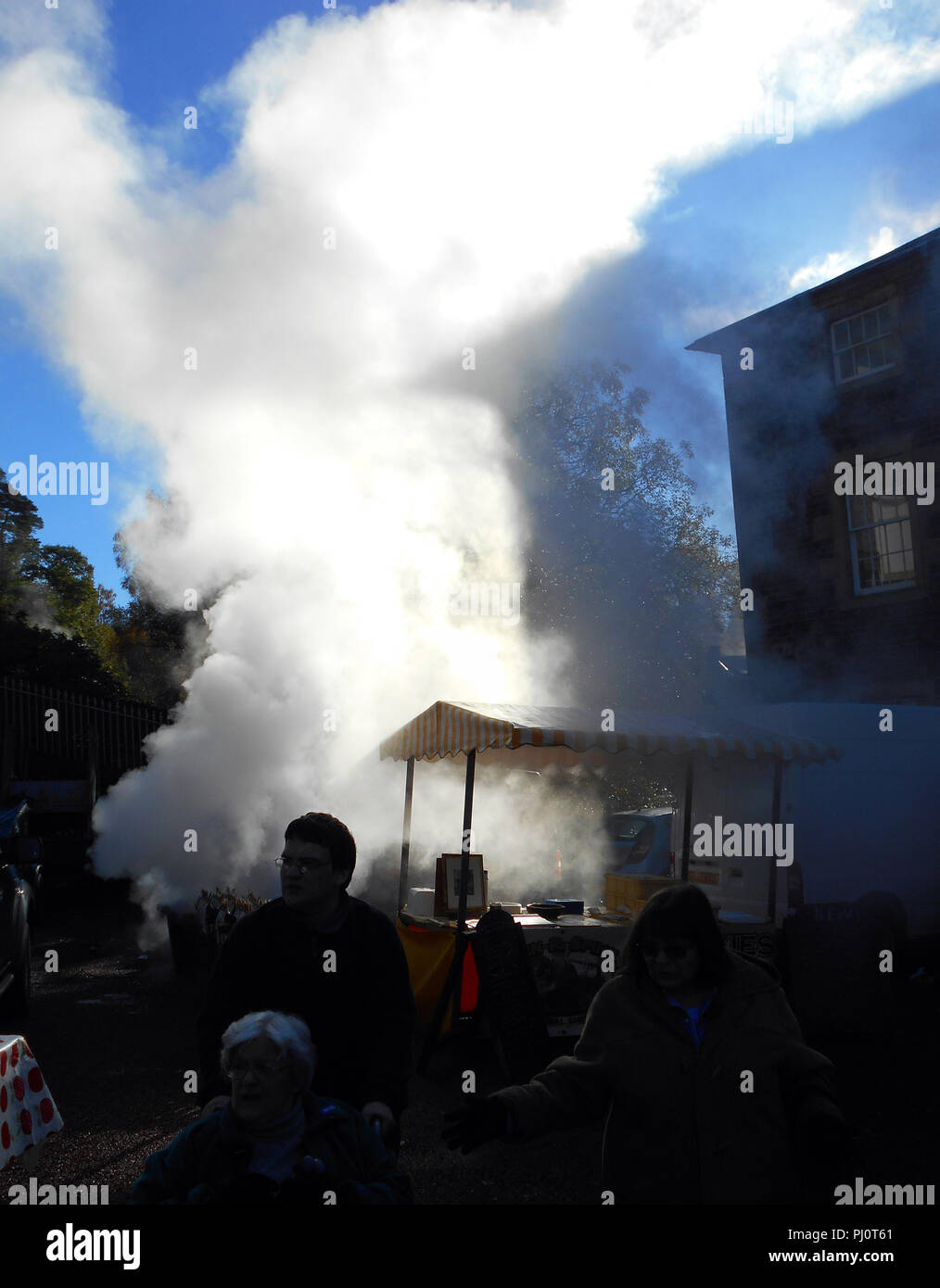 Plumes of smoke billow from a fishmongers stall where fresh haddock is ...