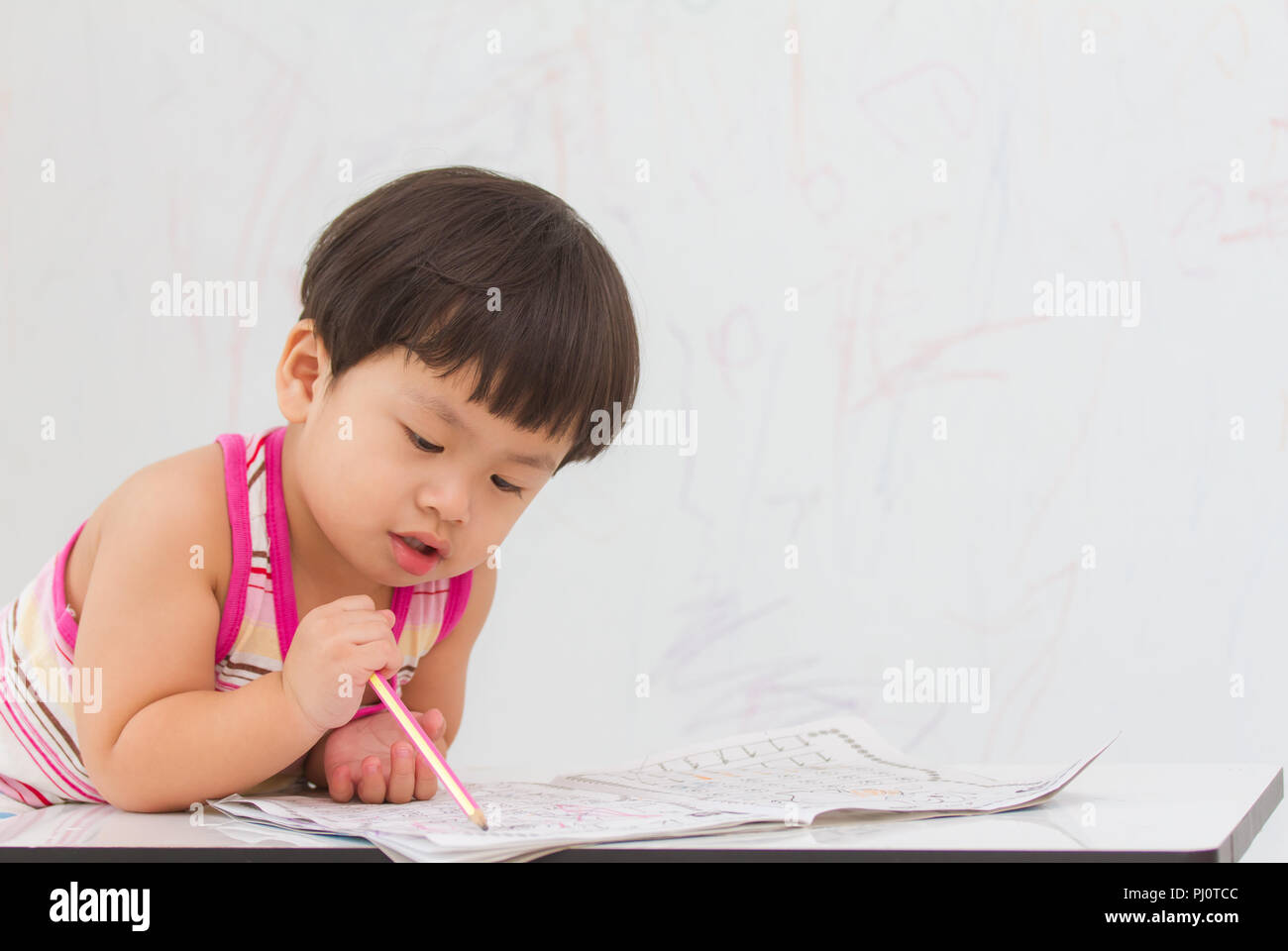 Little boy writing white paper Stock Photo - Alamy