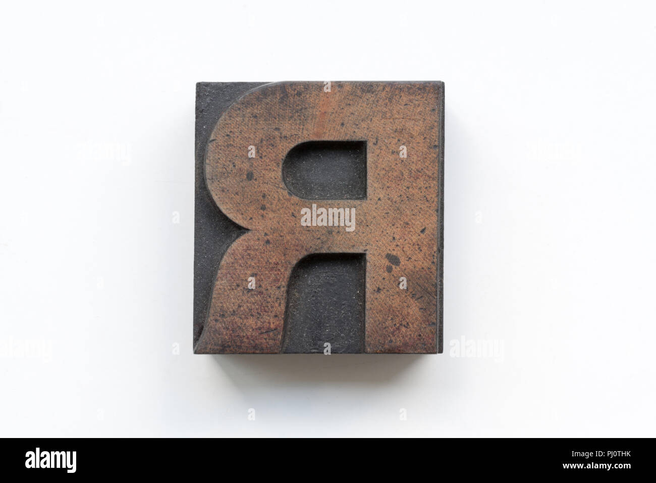 Letterpress letter R printing block isolated on a white background ...