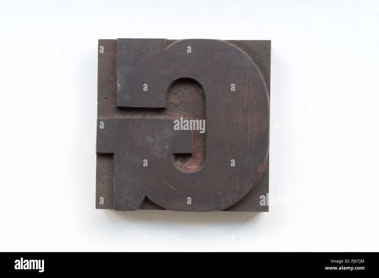 Letterpress letter G printing block isolated on a white background ...