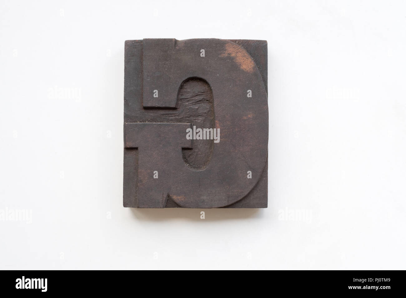 Letterpress letter G printing block isolated on a white background ...