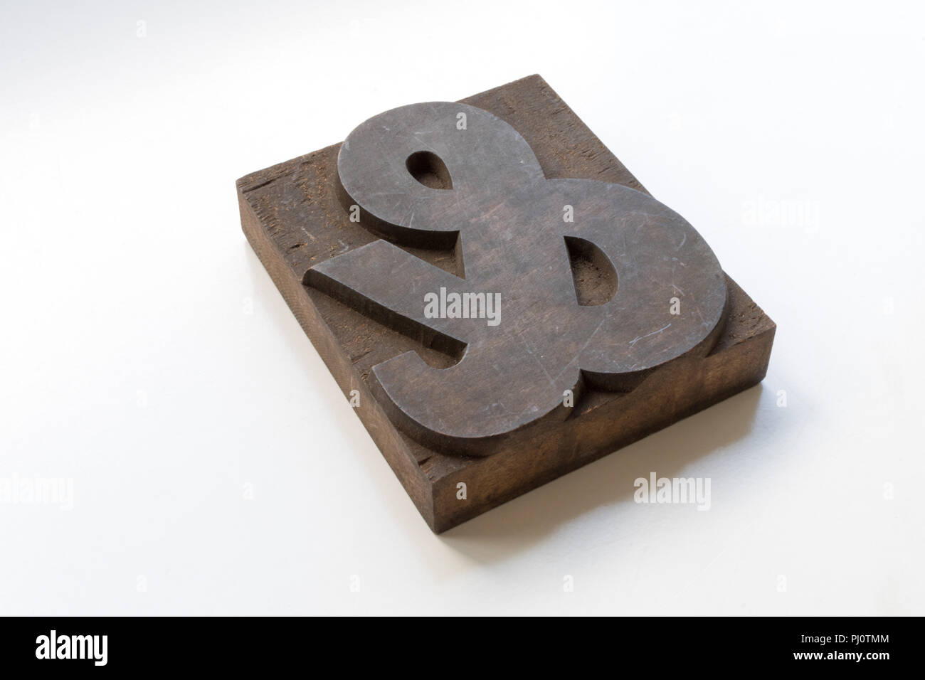 Letterpress Ampersand printing block isolated on a white background ...