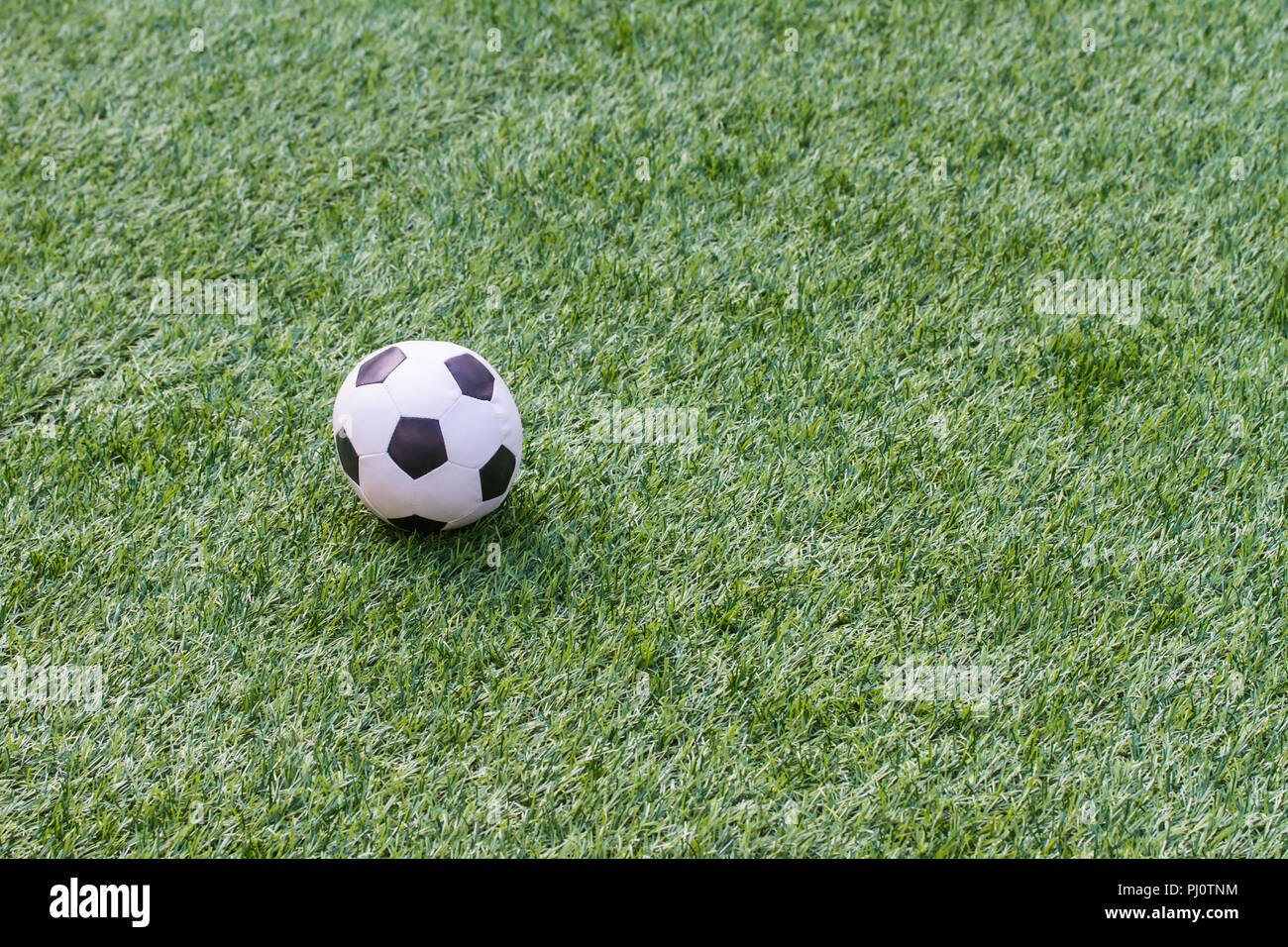 Football on the green hi-res stock photography and images - Alamy