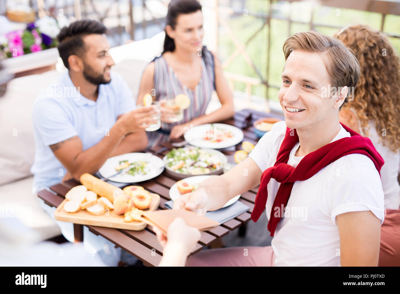 Man Paying Check in Cafe Stock Photo - Alamy