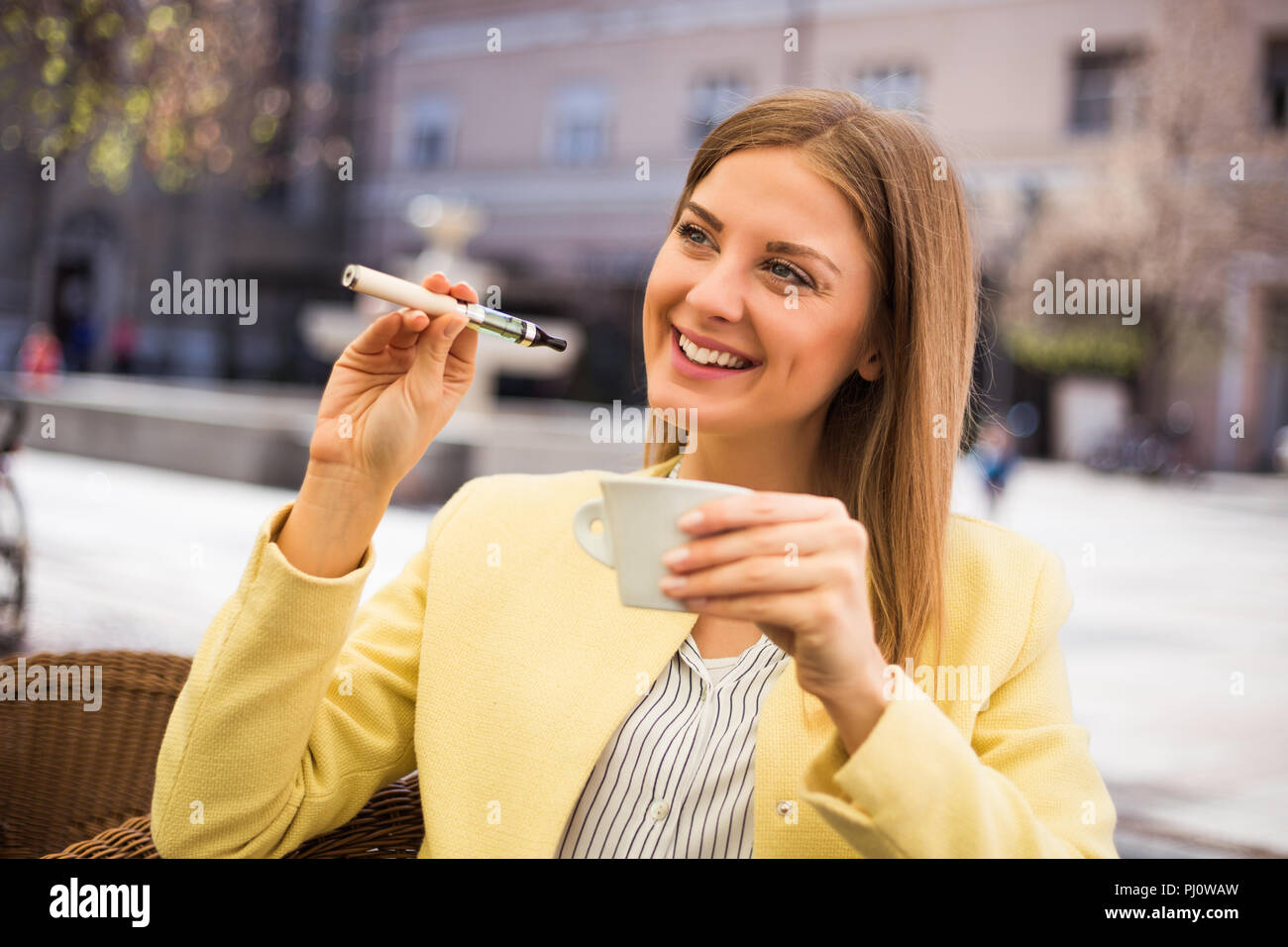 Young woman smoking cafe hi-res stock photography and images - Alamy