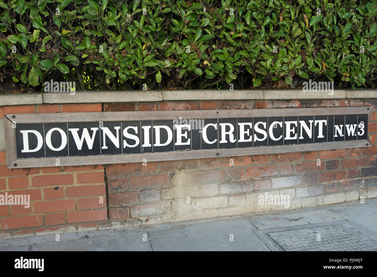 street name sign for downside crescent, belsize park, london, england ...
