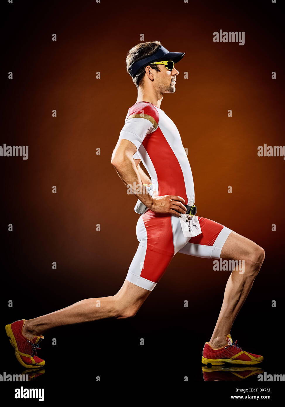 one caucasian man runner running triathlon ironman isolated Stock Photo ...
