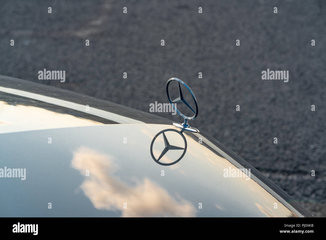 Mercedes bonnet mascot with clouds reflected on the bonnet Stock Photo ...