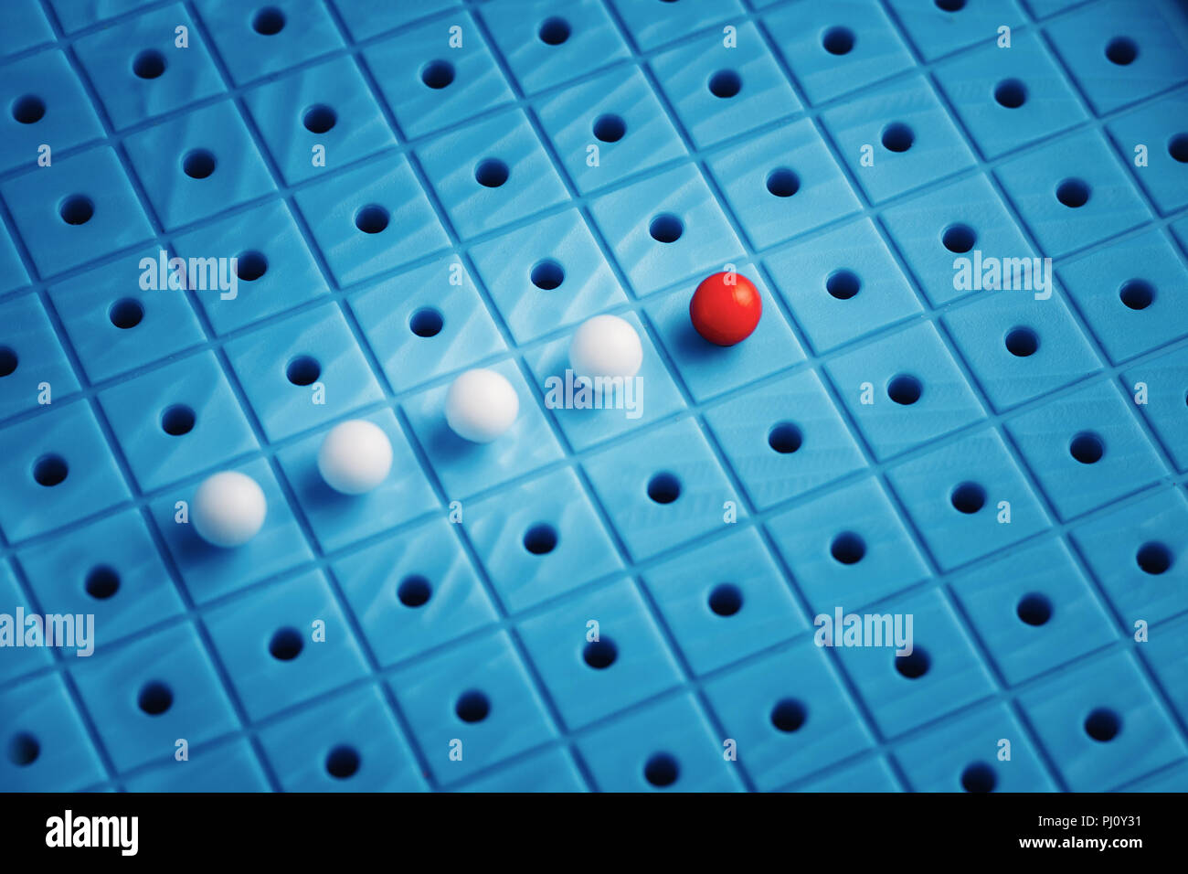 red pin leading white ones on blue background, concept of leadership ...