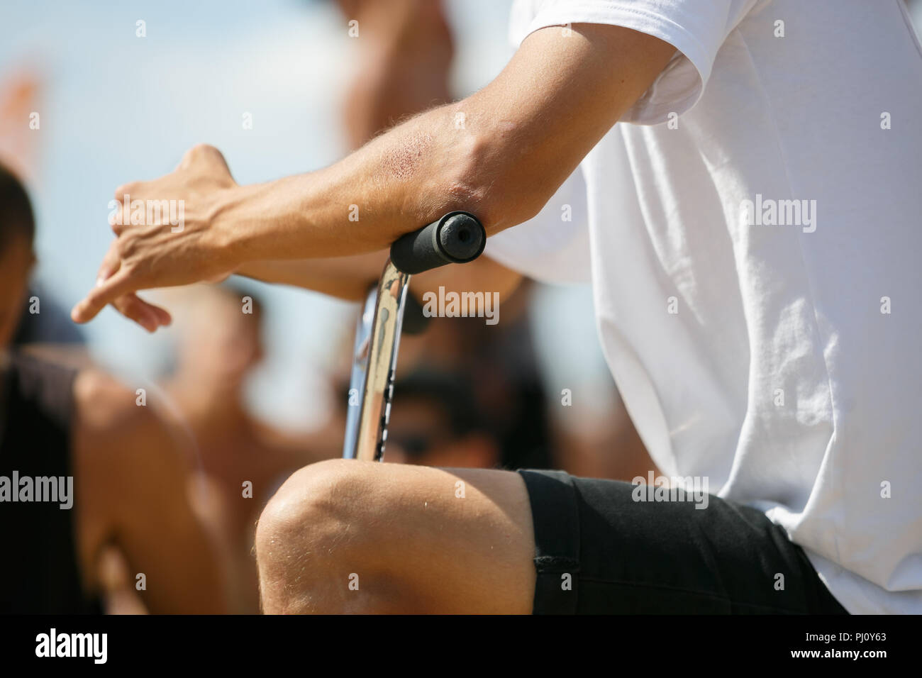Young BMX rider sitting on bicycle in outdoor park at summer extreme ...