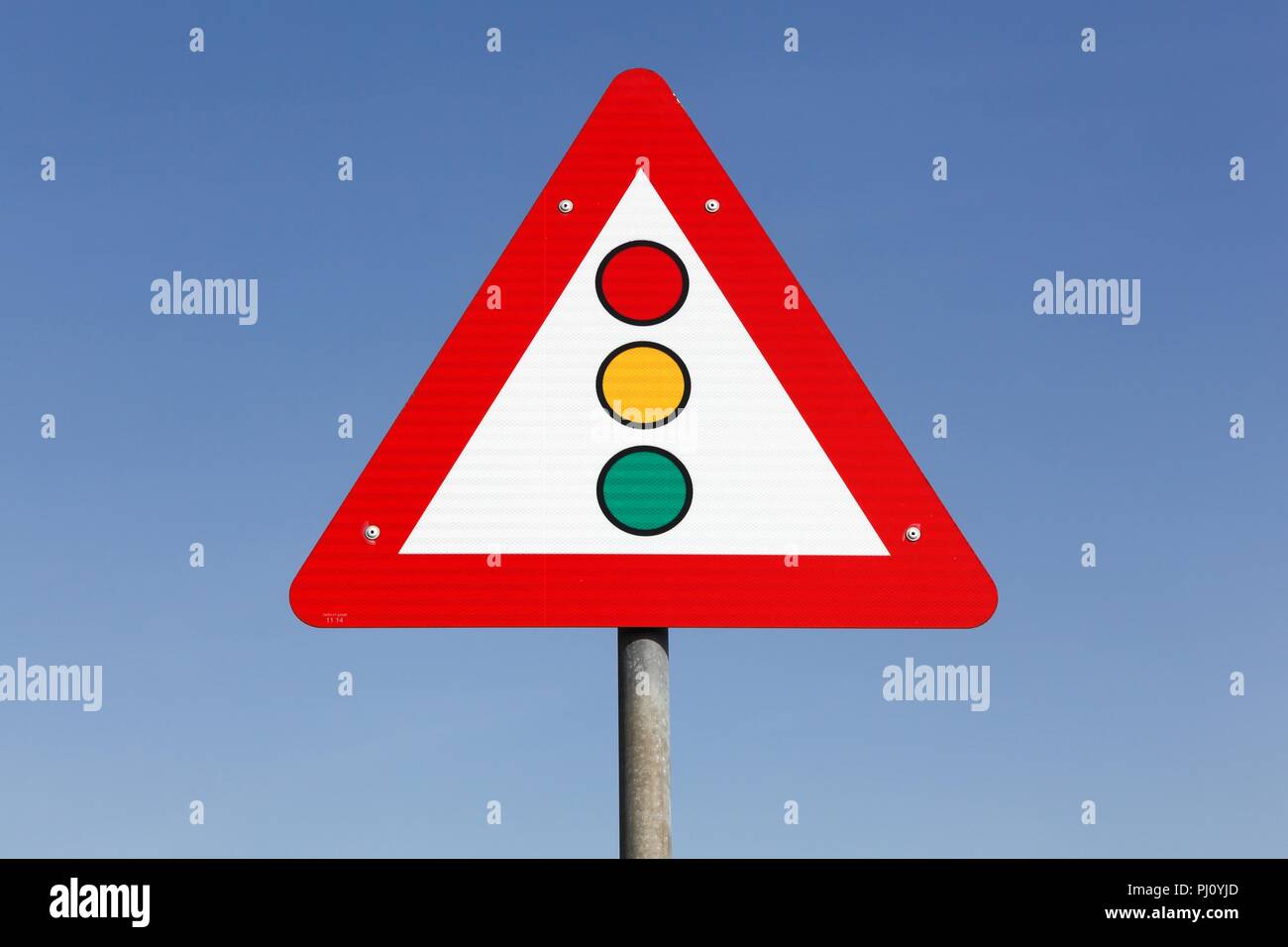 Traffic lights warning triangle road sign Stock Photo - Alamy