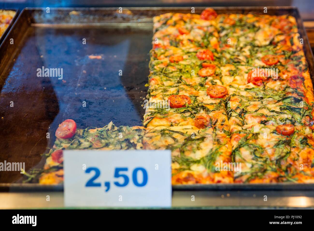 Italian pizza to go. Pizza in pieces. Take away food. Street food Stock ...