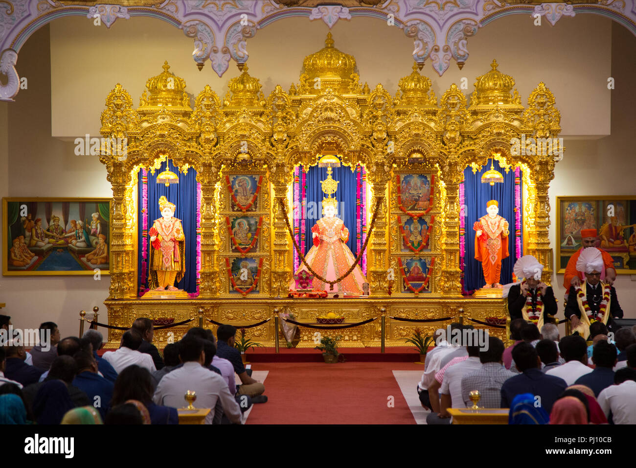 Worshippers in front of deities at the Kingsbury Hindu temple ...
