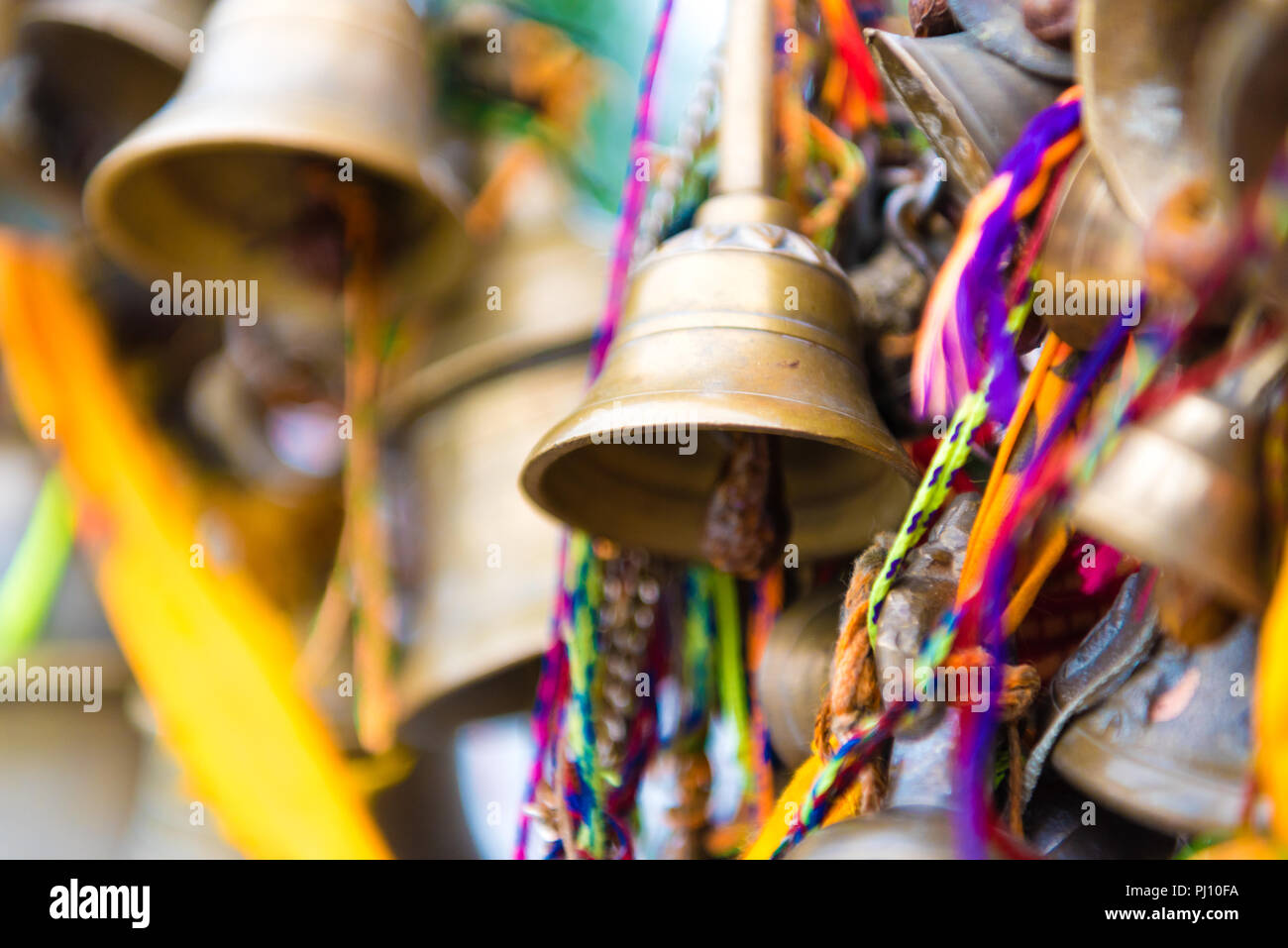 Prayer bells at buddhist temple in Kathmandu, Nepal Stock Photo - Alamy