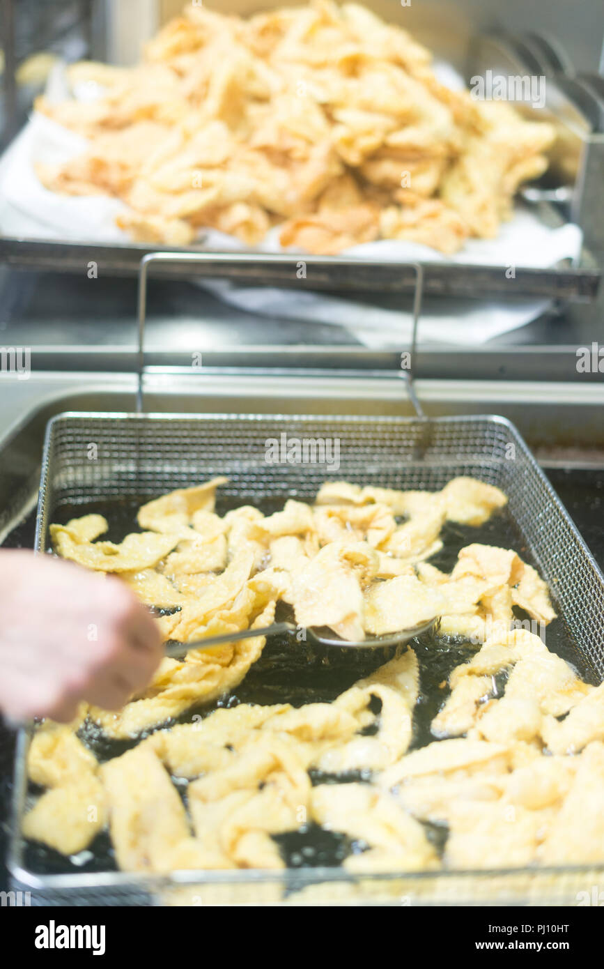 Making fried and baked sweets fin the professional kitchen of the ...