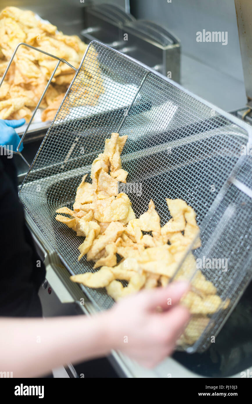 Making fried and baked sweets fin the professional kitchen of the ...