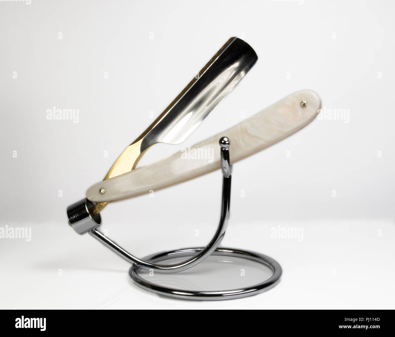 Straight razor in stand isolated on white background. Shaving razor ...