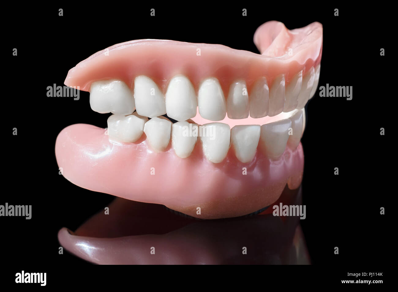 Medical denture smile jaws teeth isolated on black background Stock ...