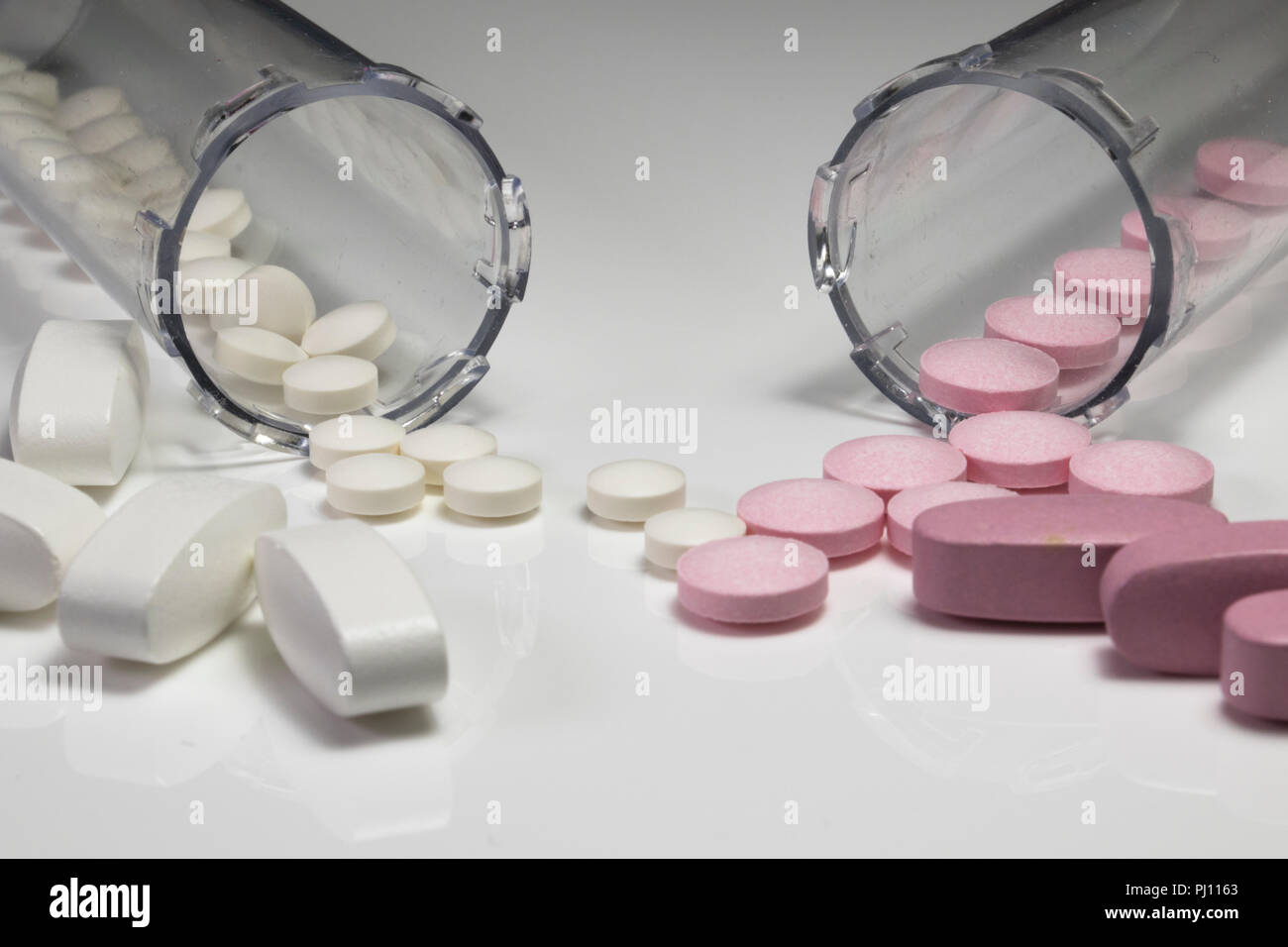 Diet pill on white background. Drugs and Medication spilling out of an ...