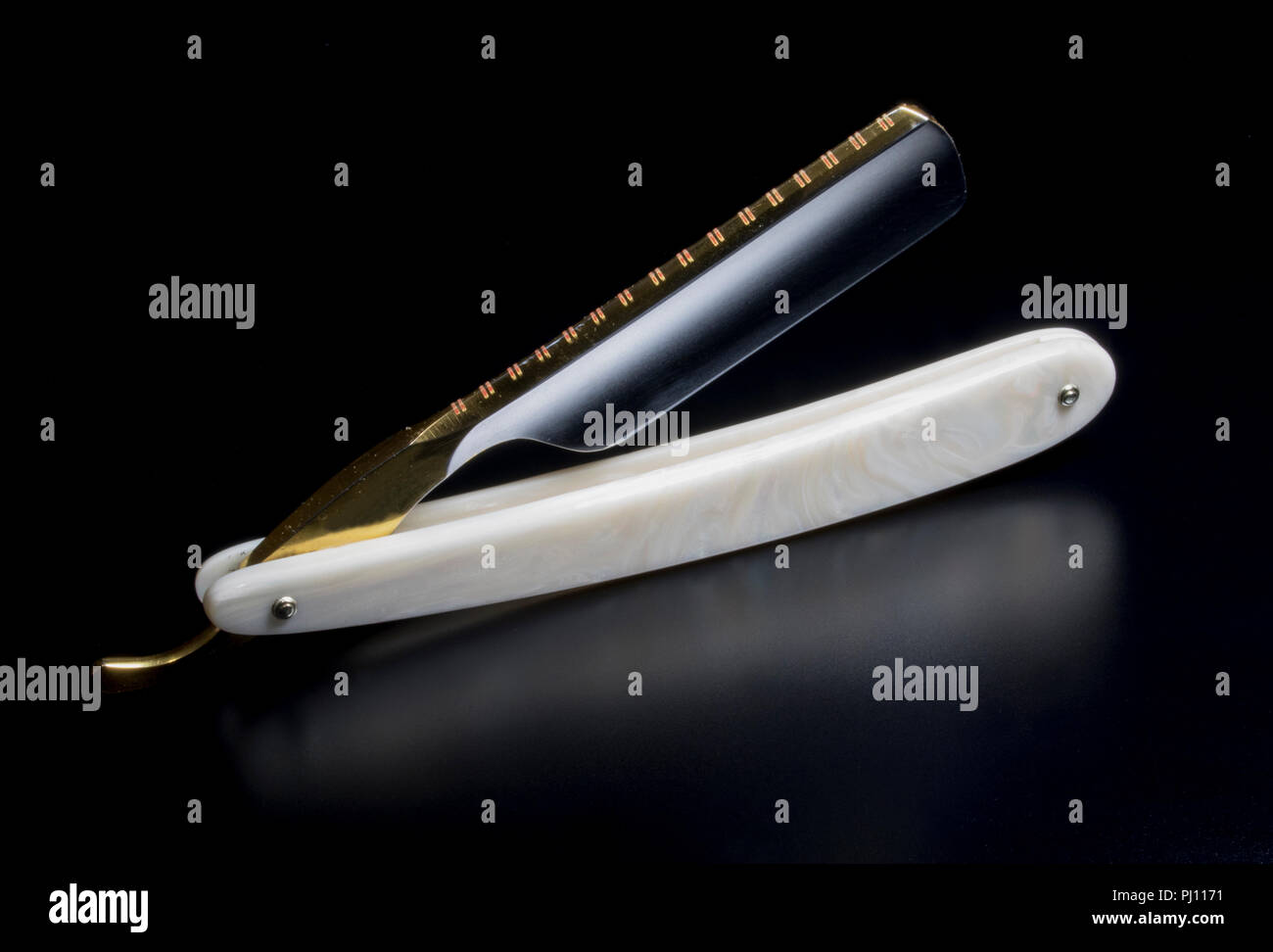 Shaving Razor Isolated on Black background. Gold and white men's razor ...