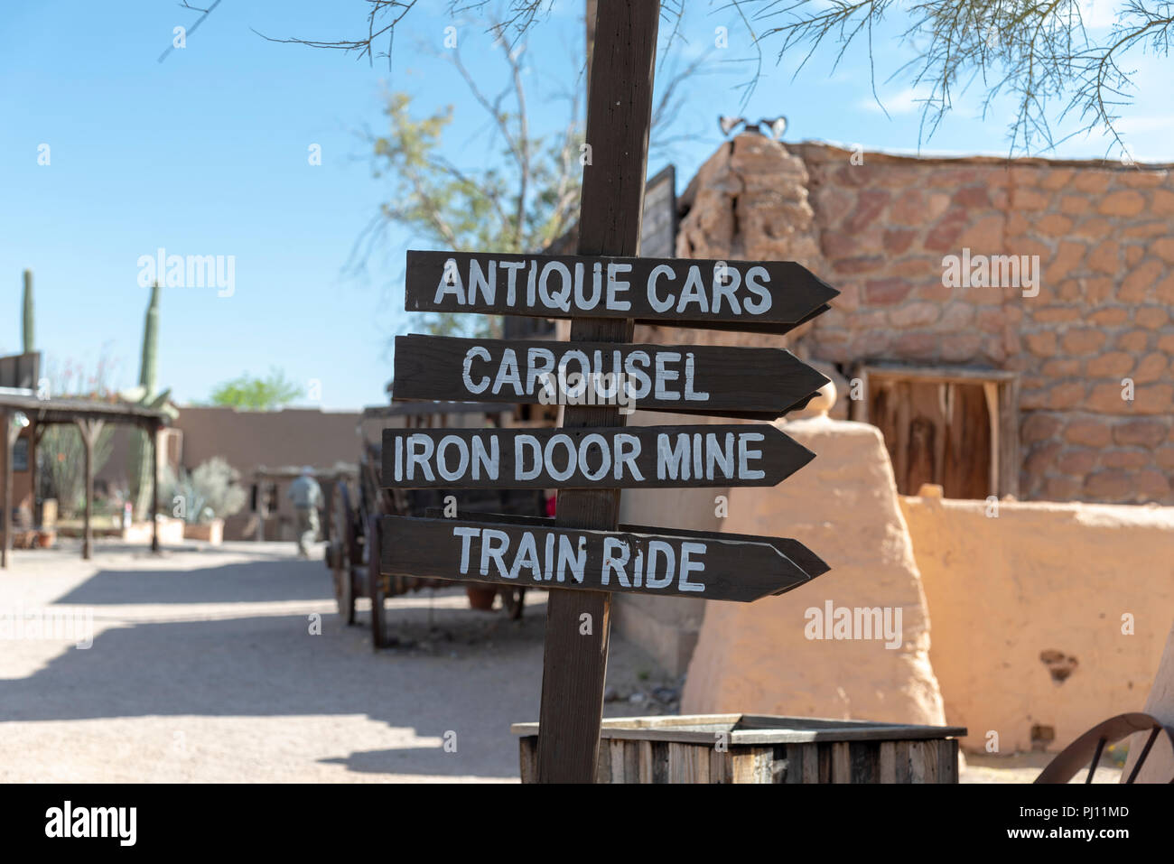 Old wooden signs nailed to a post showing directions to places in Old ...