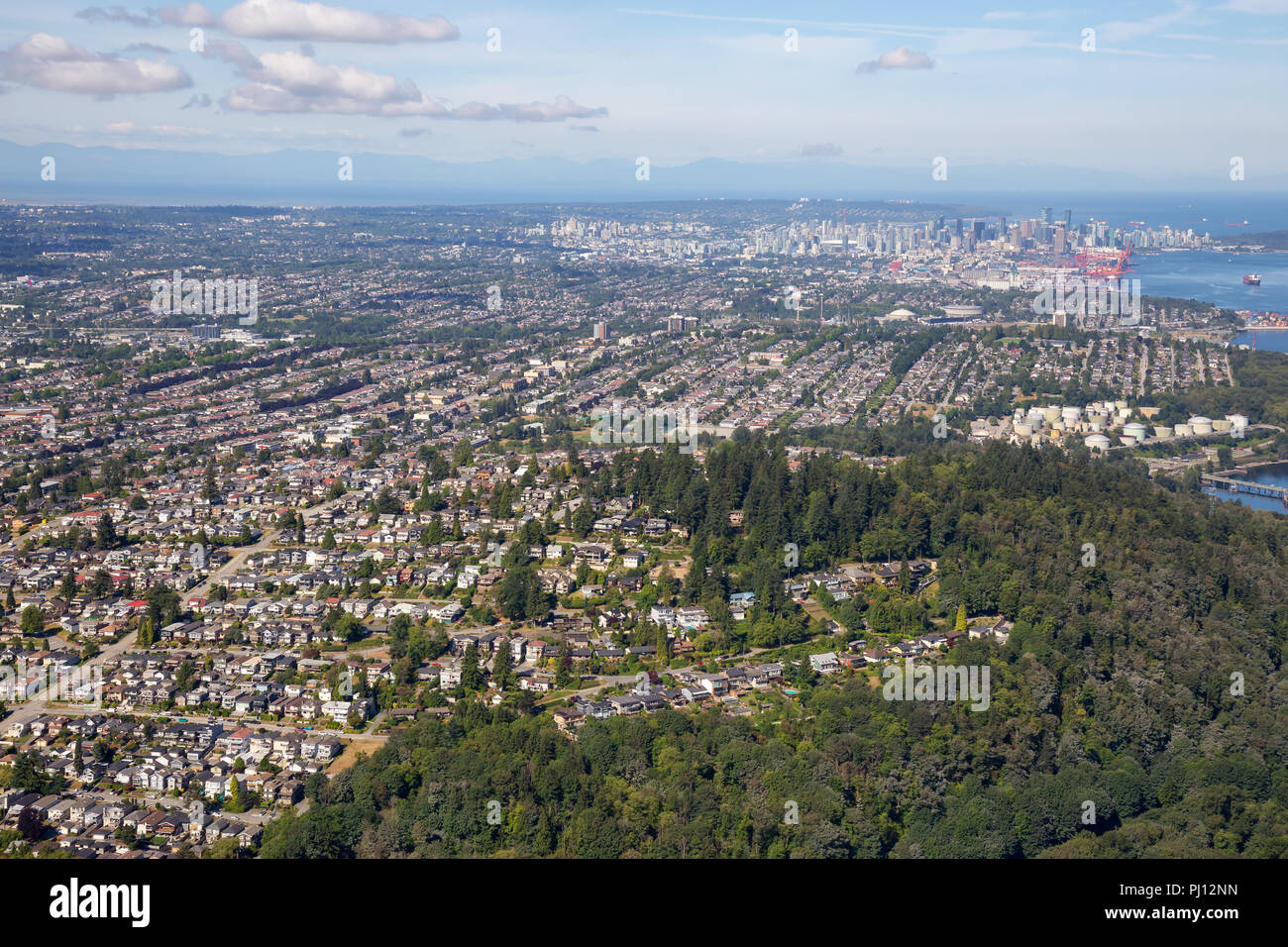 Aerial view of residential homes with Downtown City in the Background ...