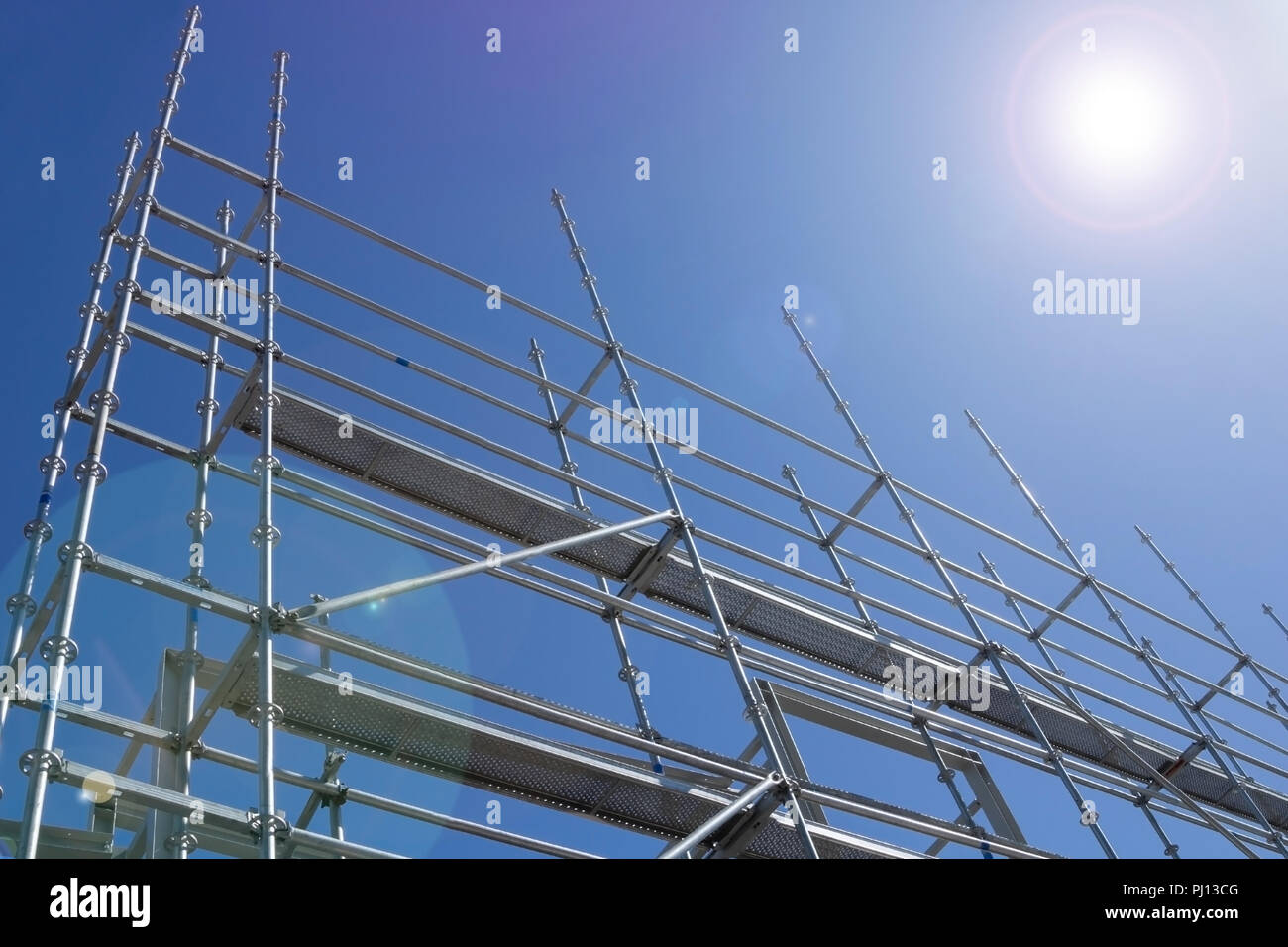Steel construction scaffolding erected and rising into sky Stock Photo ...