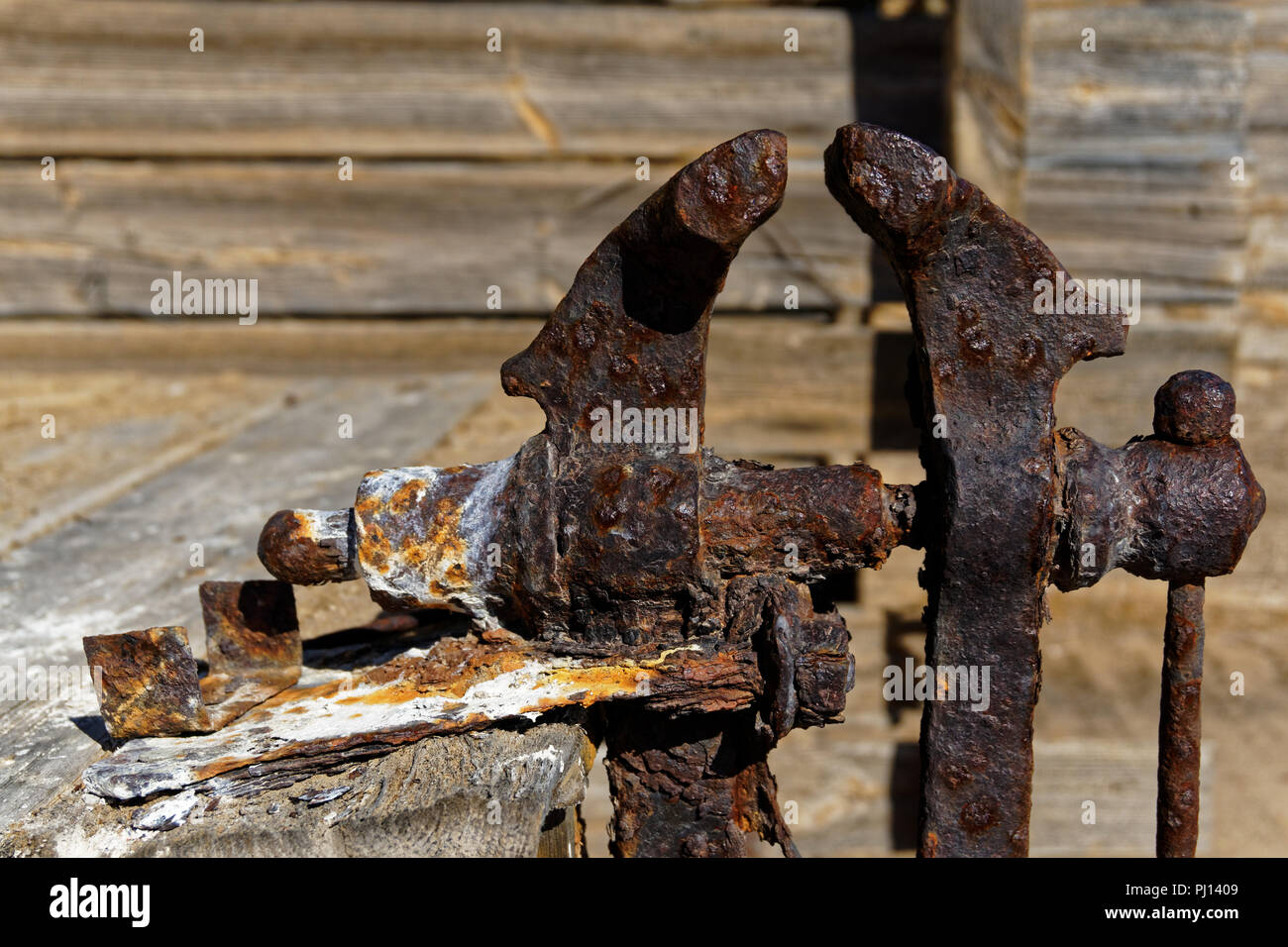 Rusty flaking iron vice or bench clamp Stock Photo - Alamy