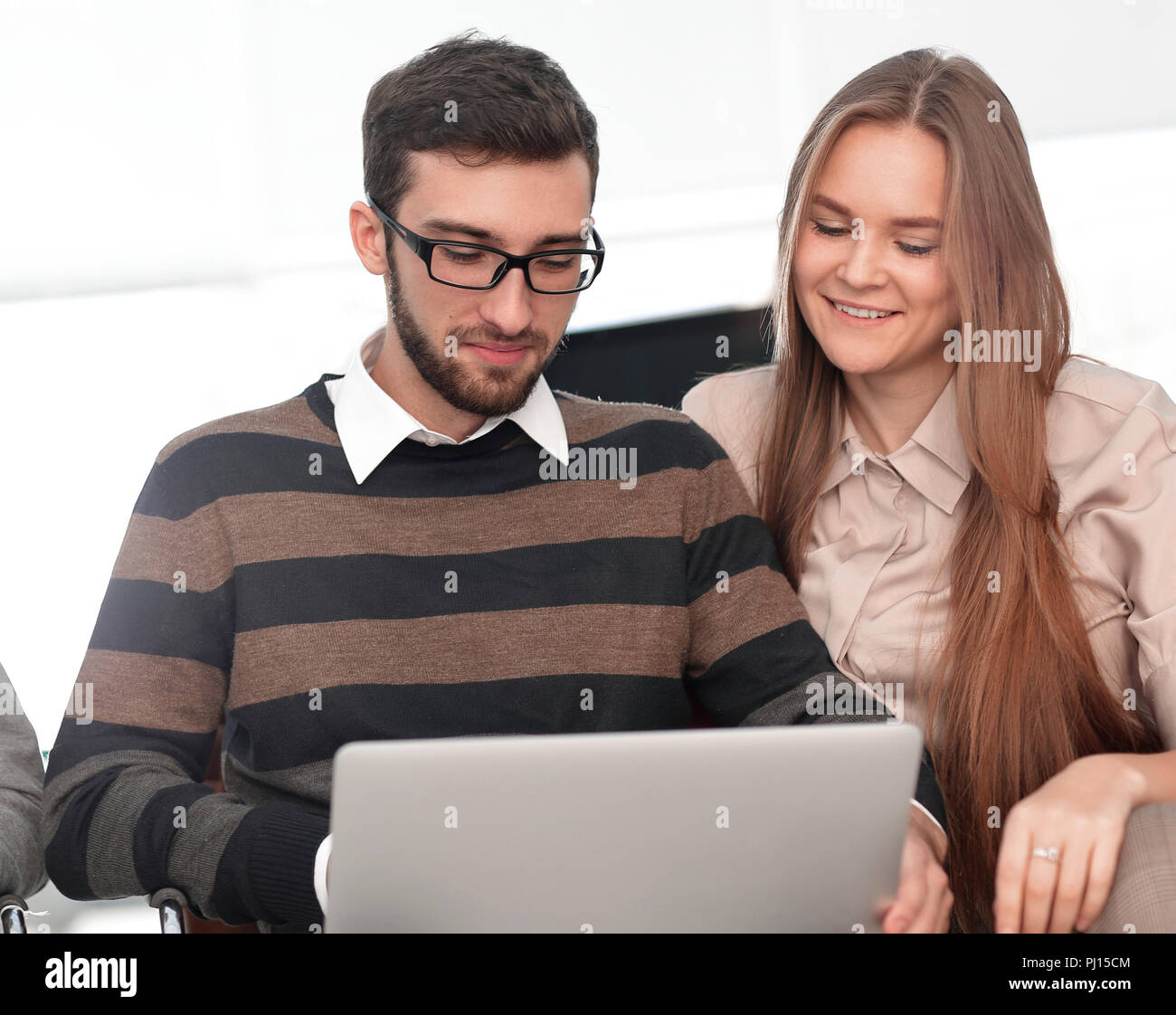 employees working on laptop Stock Photo - Alamy