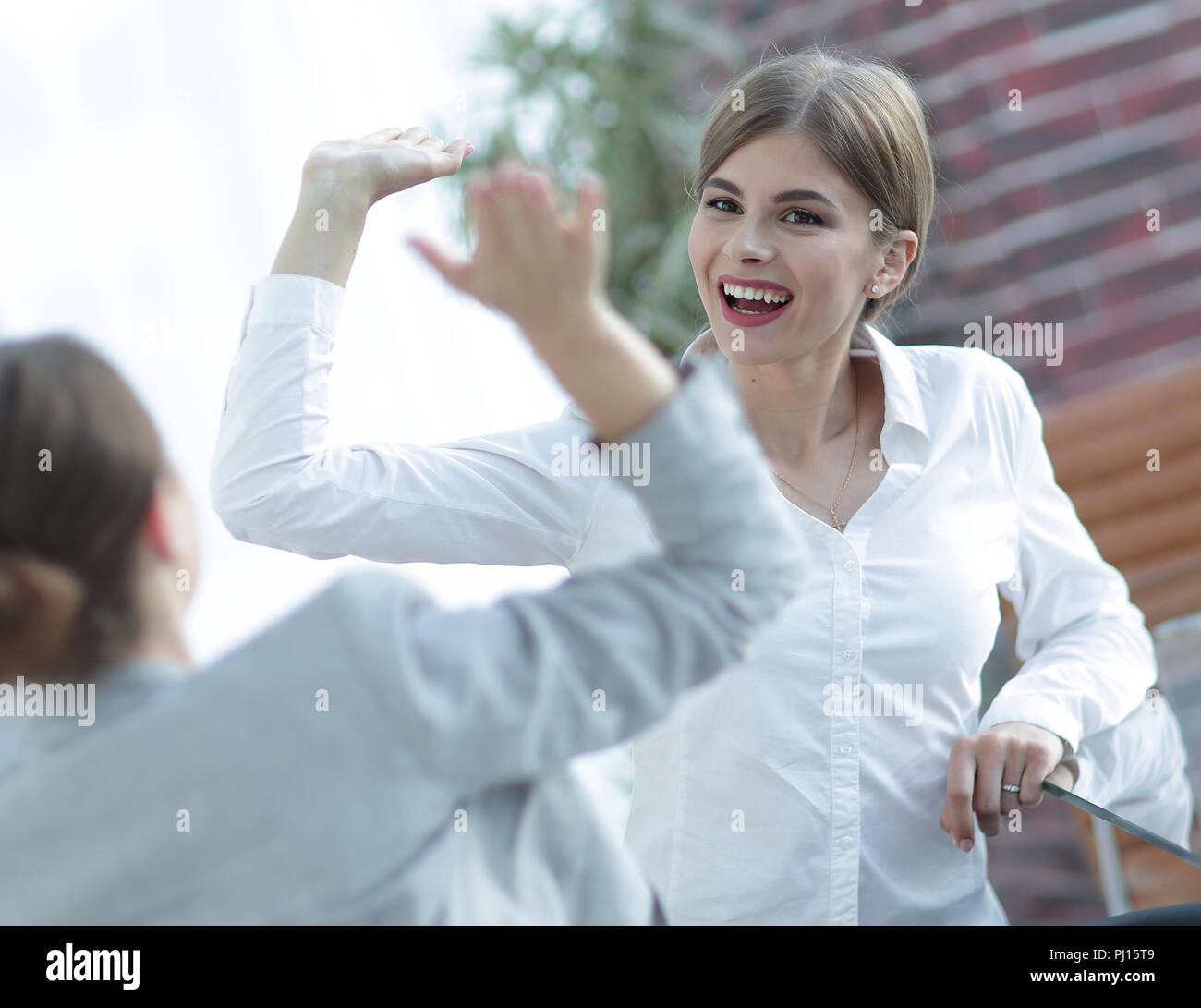 Two staff members smile hi-res stock photography and images - Alamy