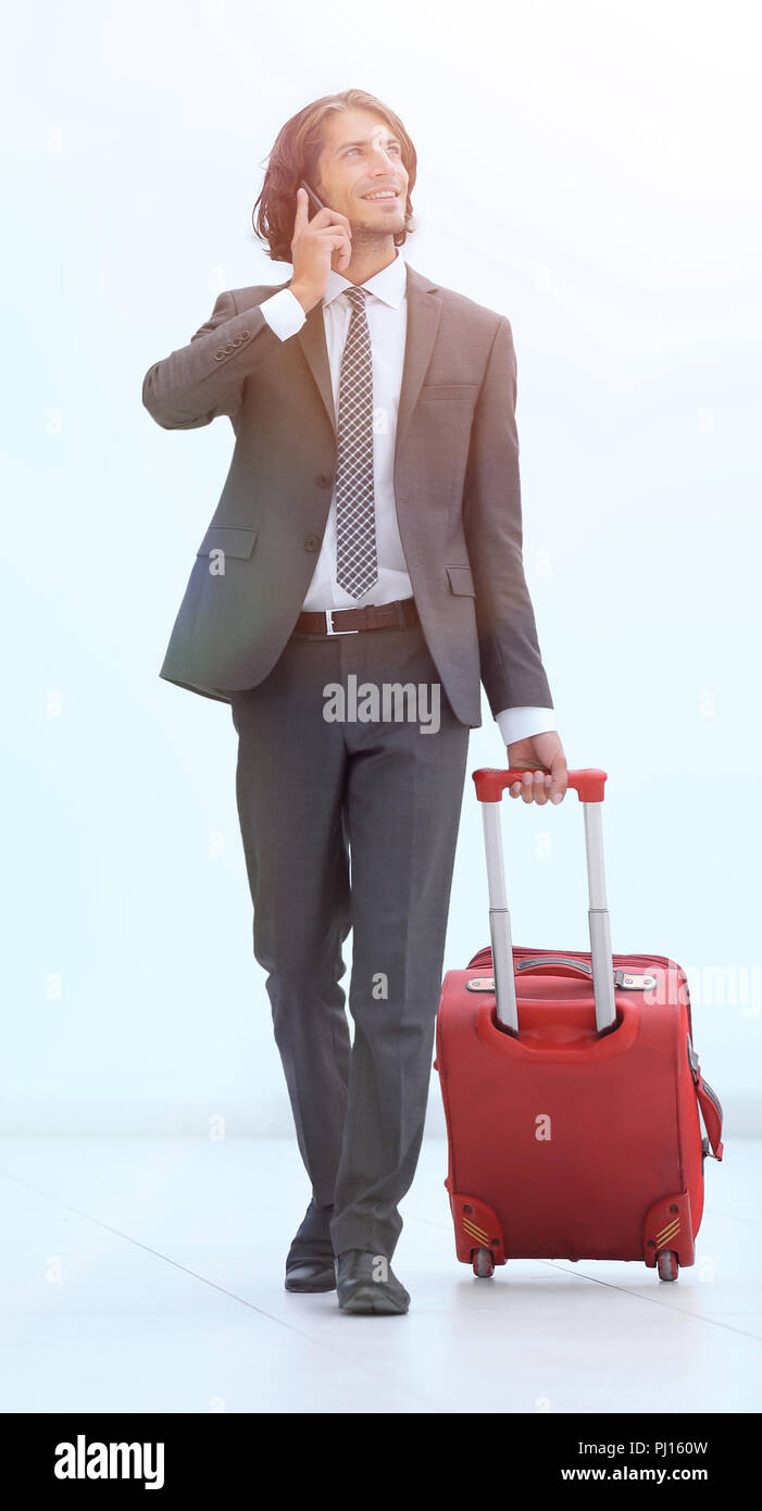 successful businessman with travel suitcase Stock Photo - Alamy