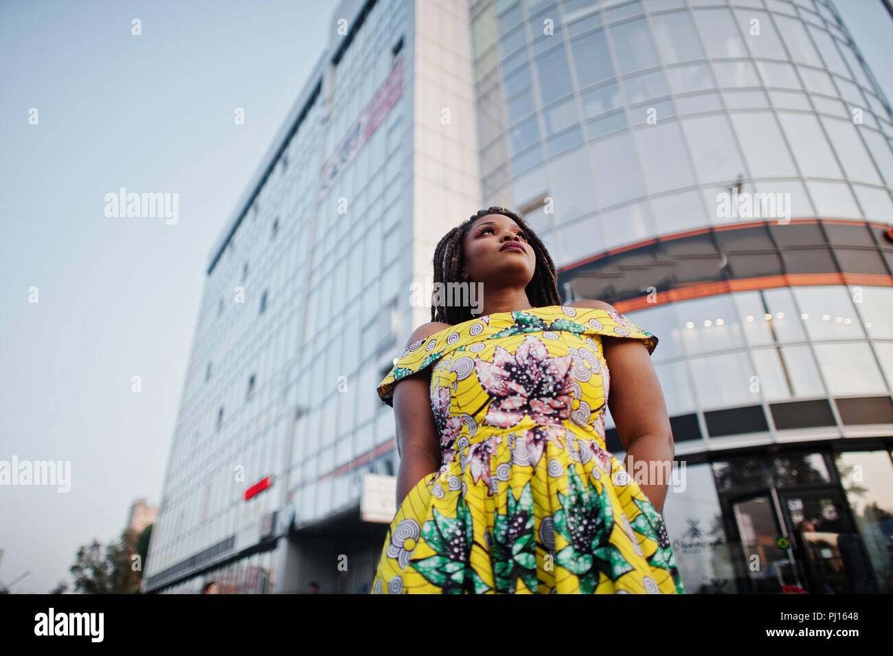 Cute small height african american girl with dreadlocks, wear at ...