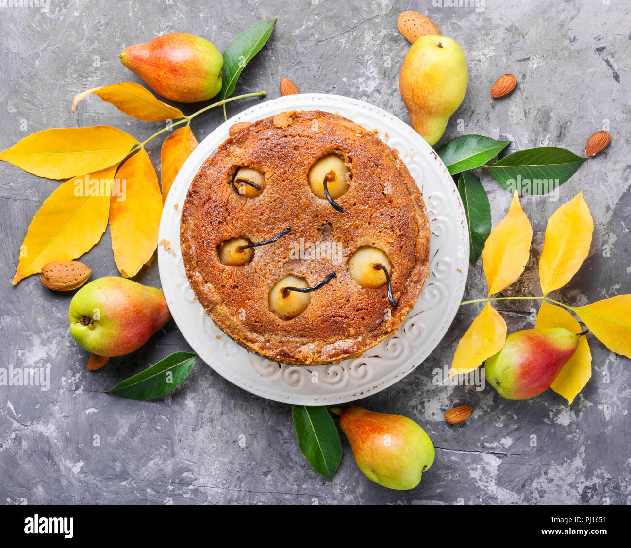 Rustic pie with pears and fallen autumn foliage. Autumn kitchen Stock ...