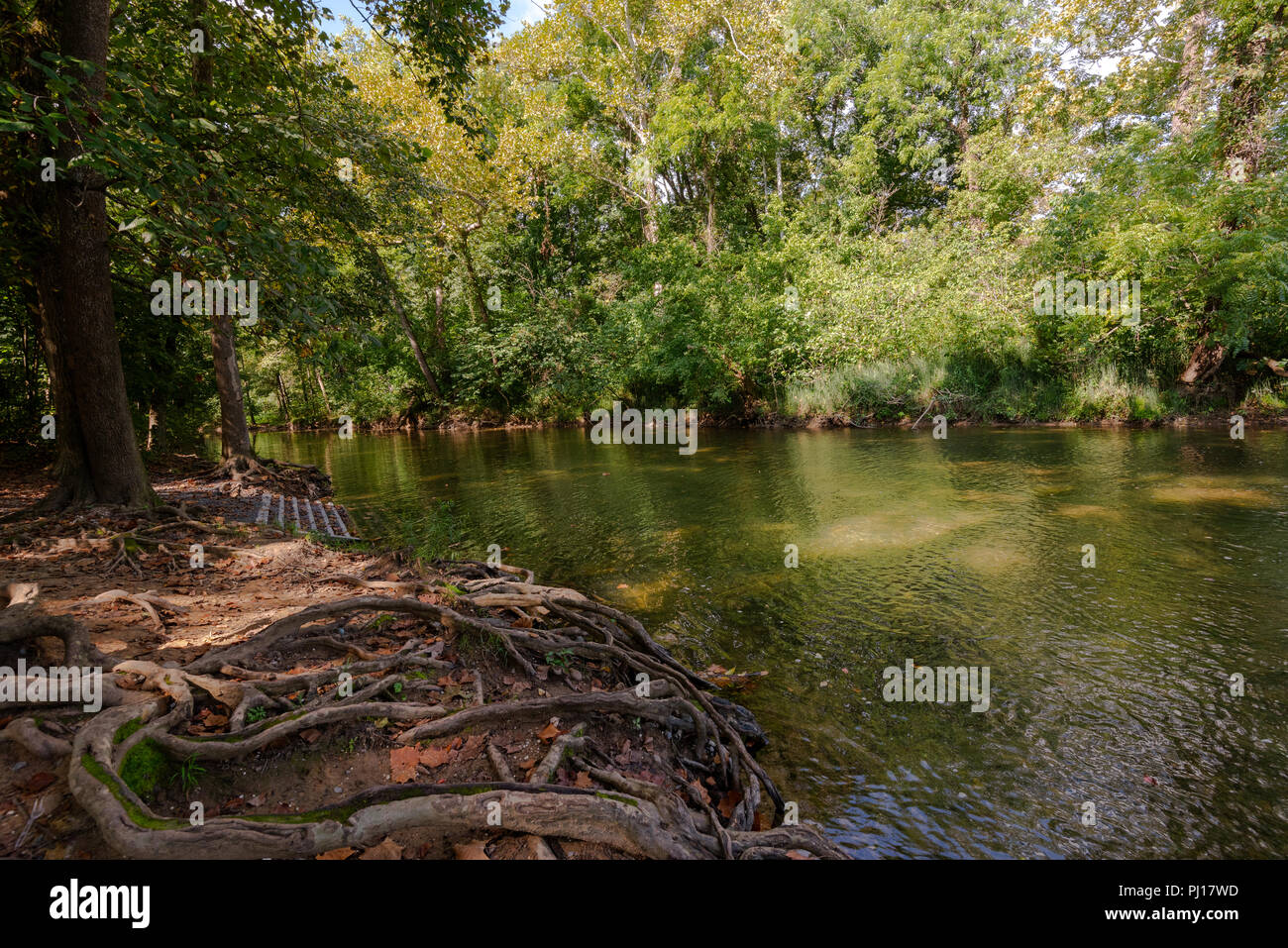 The Shenandoah River bends around a curve by a canoe launch Stock Photo ...