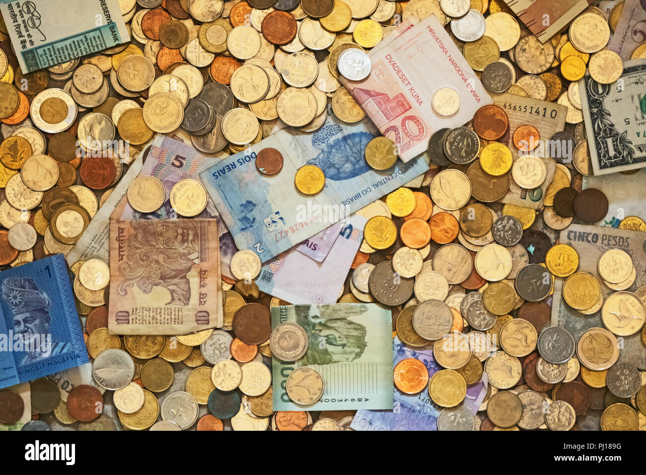 Lots of different money. Banknotes and coins Stock Photo - Alamy