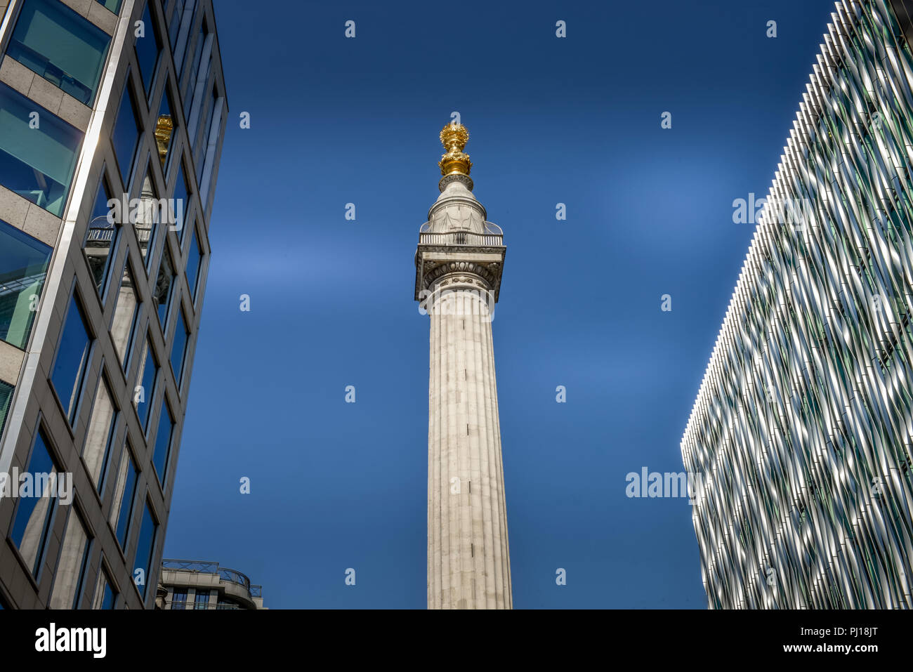 Financial district with monument to the great fire of london hi-res ...