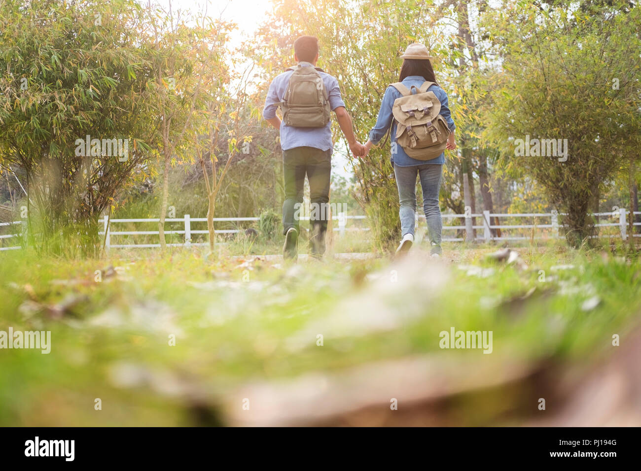 Outdoor shot of happy young loving couple hikers at valley of the ...