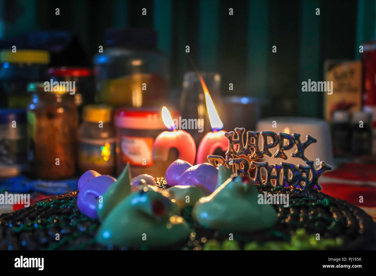 Birthday Celebration with candles, bright lights, foods, wax. Bright ...