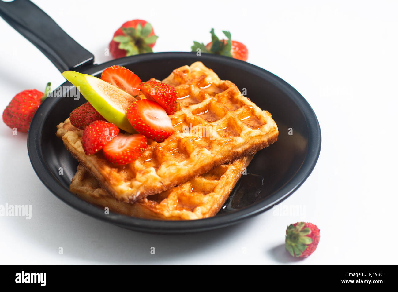 Food concept square Waffles and syrup with strawberry and fig topping ...