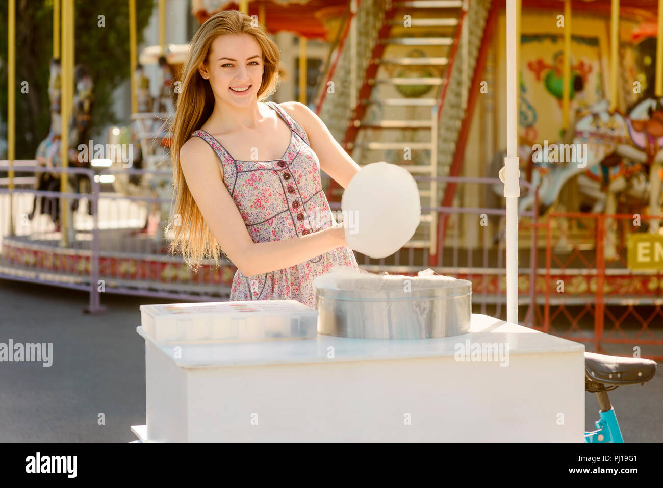 Charming lady with a cotton candy Stock Photo - Alamy