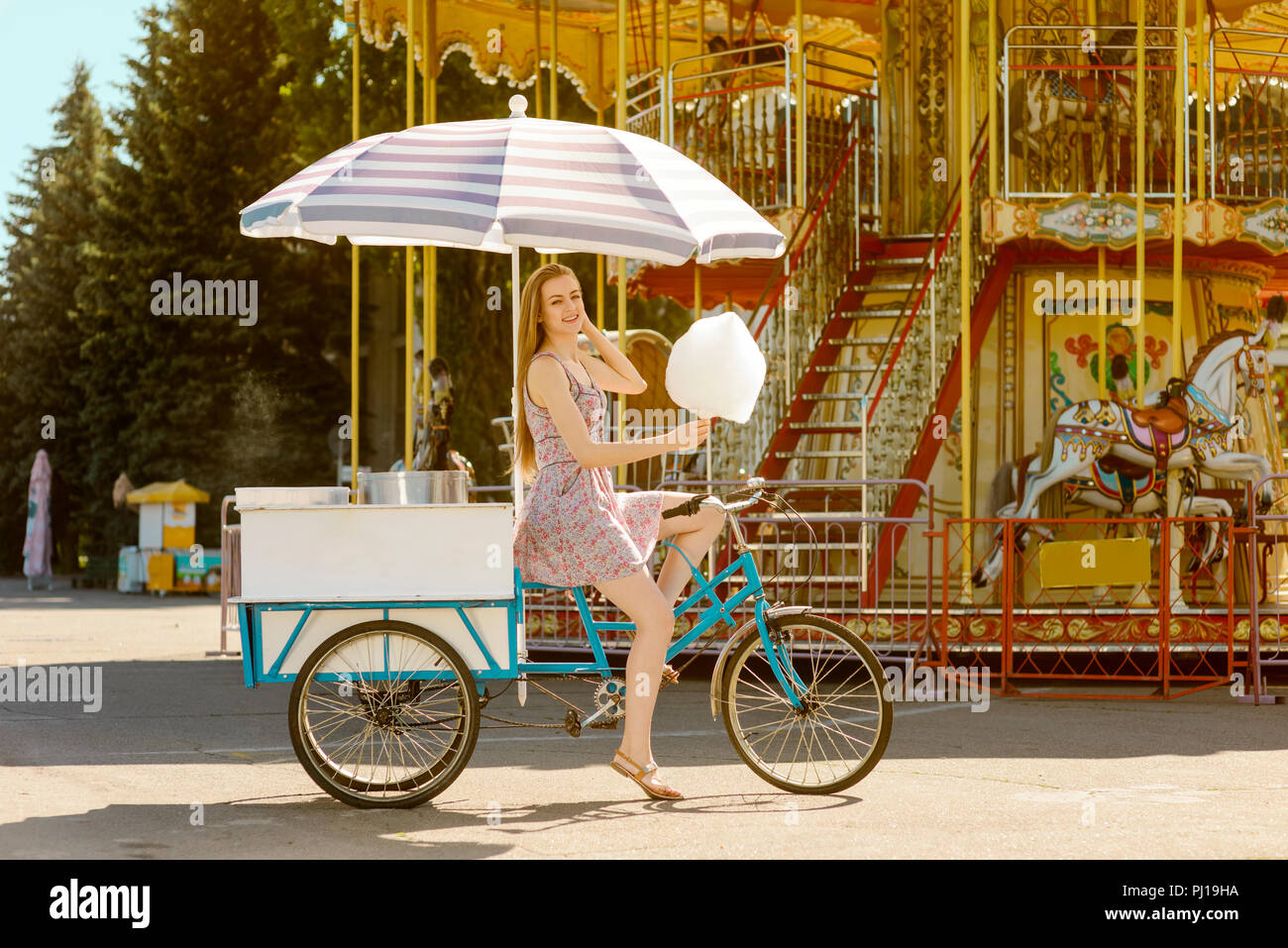 Lady on blue bicycle hi-res stock photography and images - Alamy