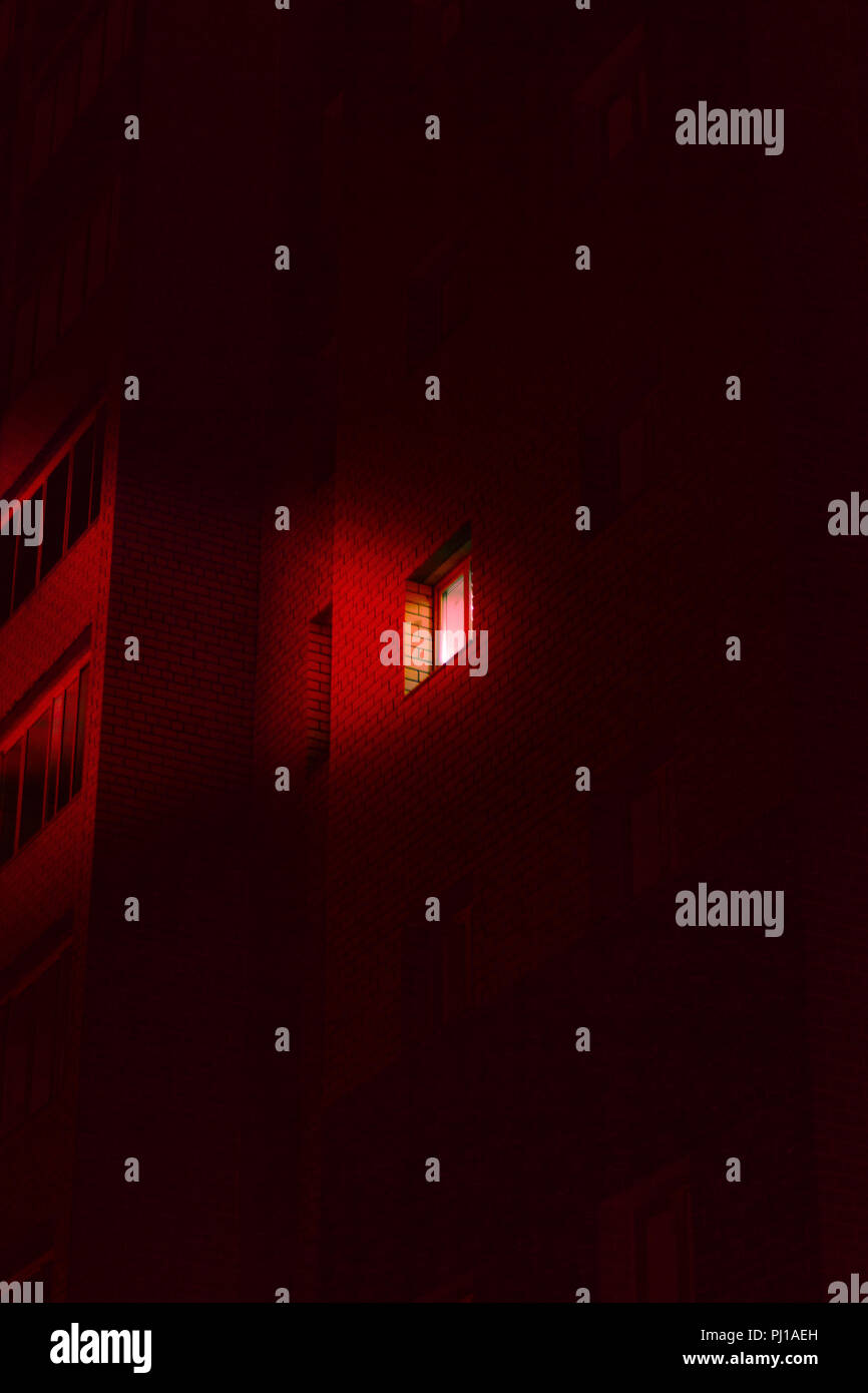 Light beaming through a window in an apartment block, Russia Stock ...