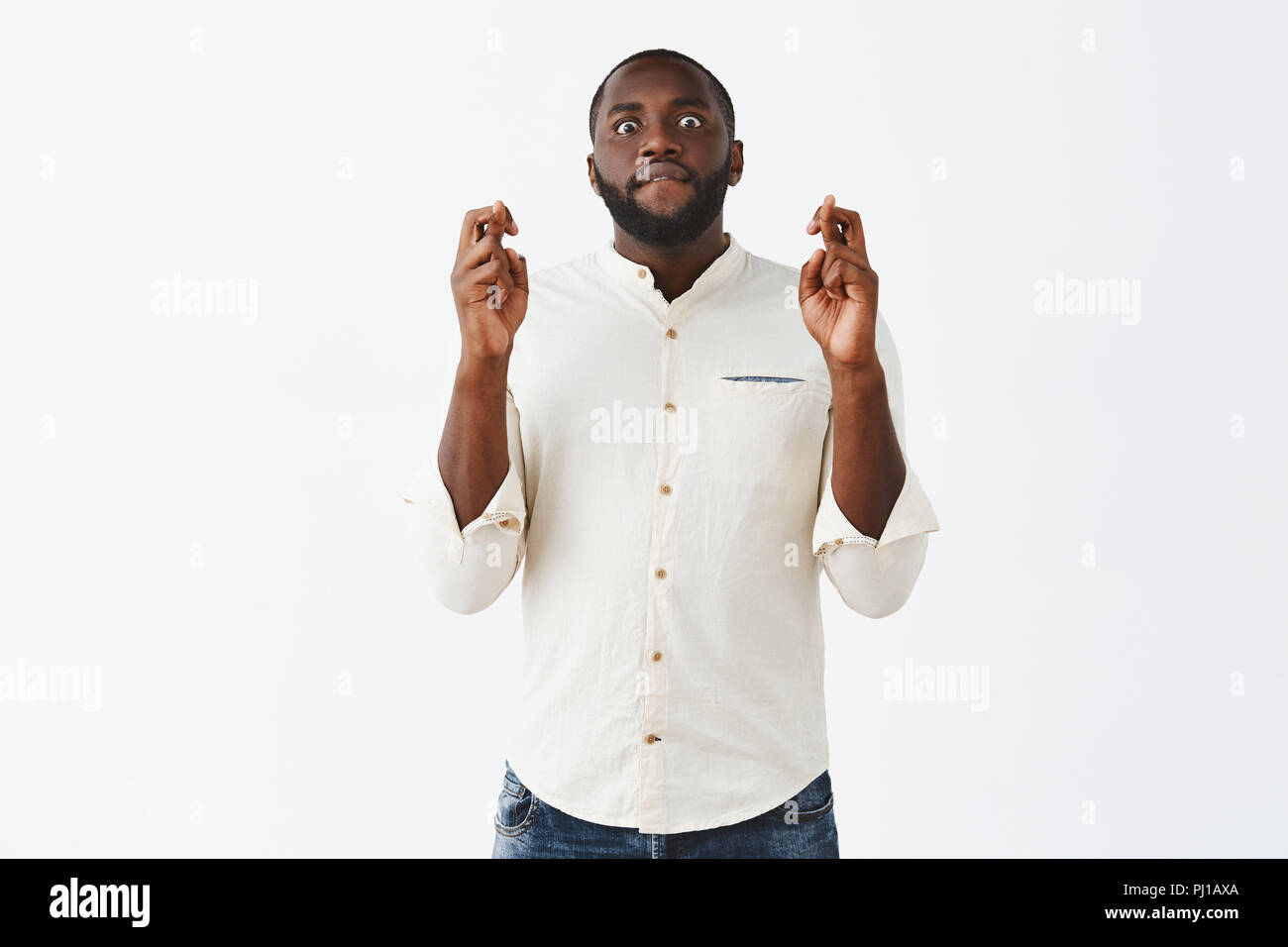 Excited young man biting hi-res stock photography and images - Alamy
