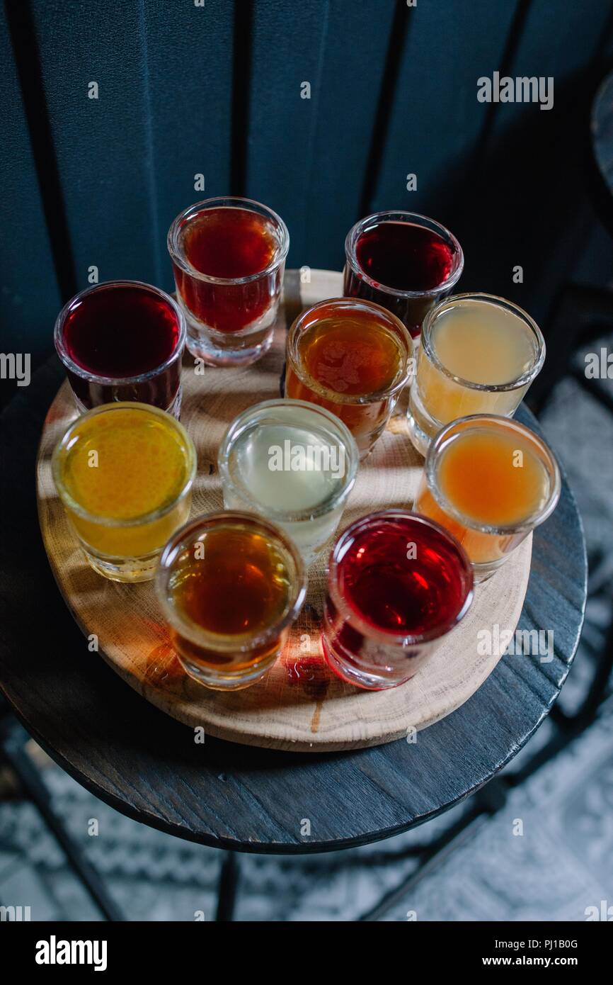 Alcohol shots on a wood stand Stock Photo - Alamy