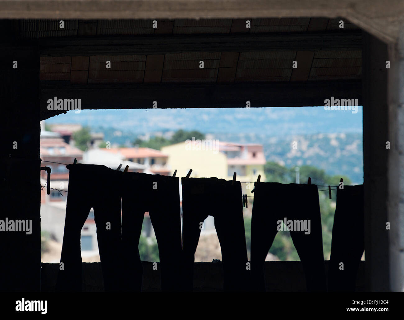 Silhouette of trousers hanging on a washing line Stock Photo - Alamy